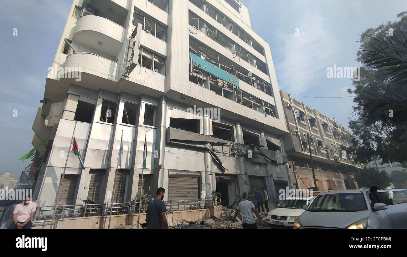 Gaza, Palestine. 8th Oct, 2023. (INT) Palestinians inspect the ruins of ...