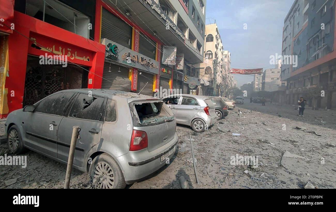 Gaza, Palestine. 8th Oct, 2023. (INT) Palestinians inspect the ruins of ...