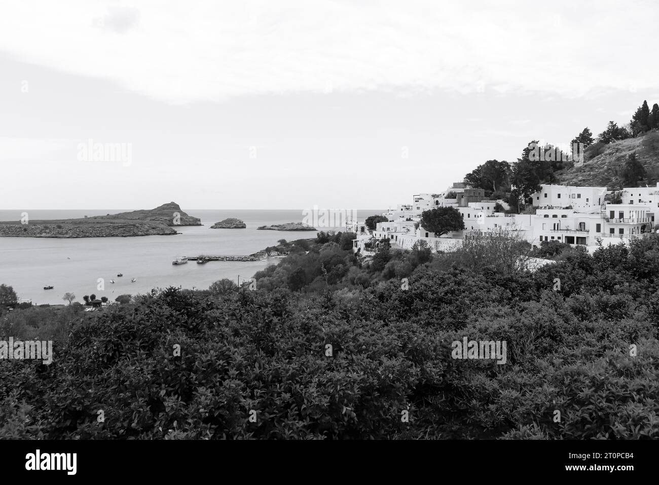 Black and white view of the Lindos Town, white house buildings along ... Black and white view of the Lindos Town, white house buildings along ...