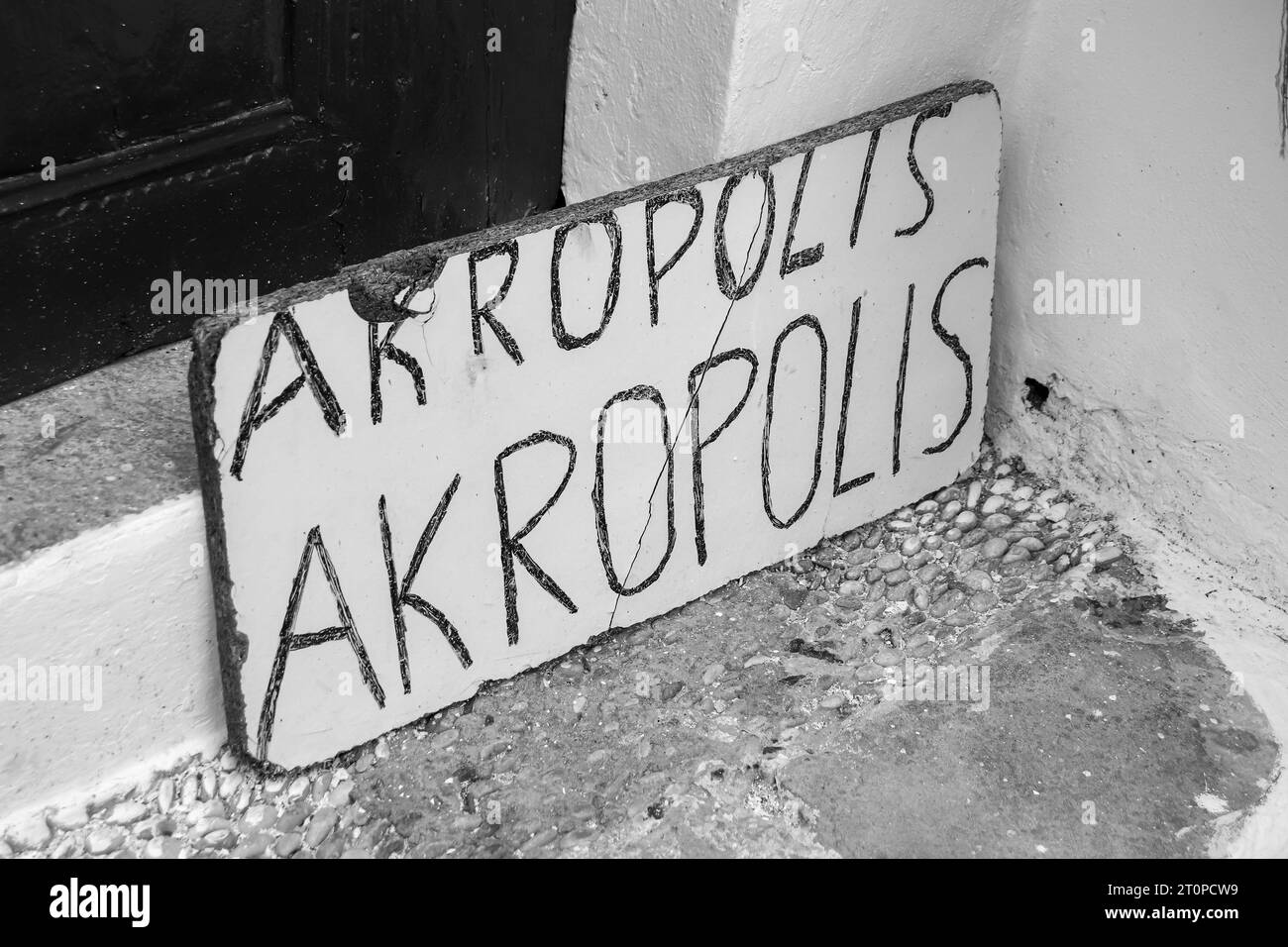 Lindos Akropolis sign leading tourist up to the famous landmark ...