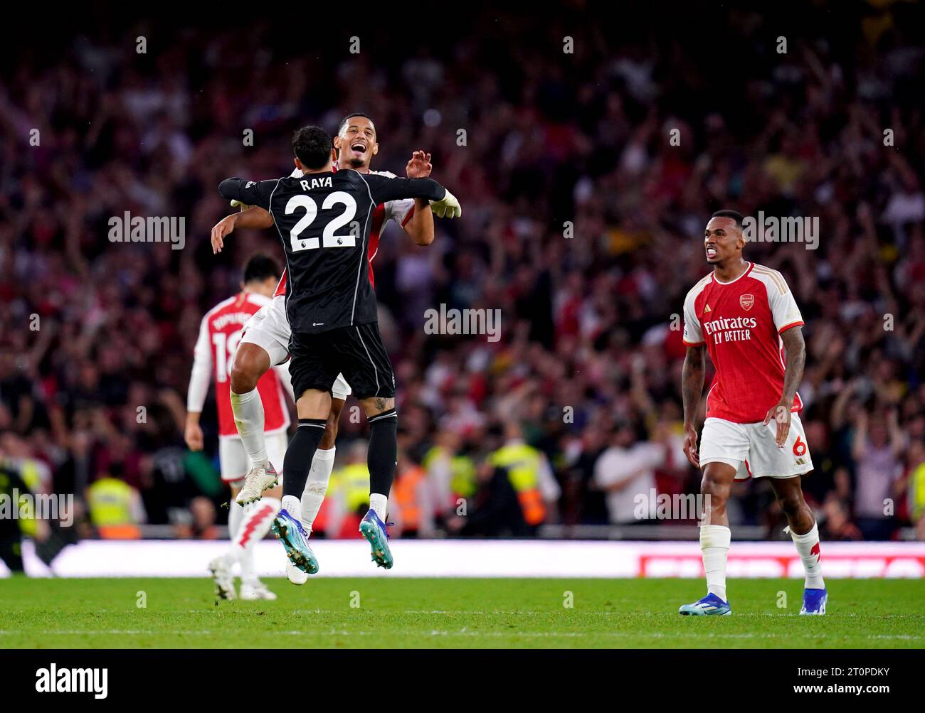 Arsenal goalkeeper David Raya celebrates with team-mate William Saliba ...