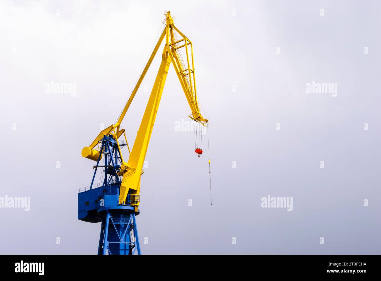 Blue and yellow crane at the Port of Belfast Stock Photo - Alamy
