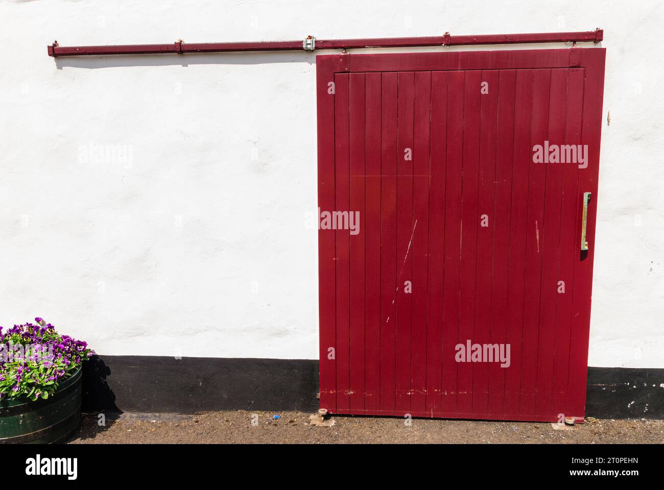 Red sliding door main entrance to a warehouse Stock Photo - Alamy