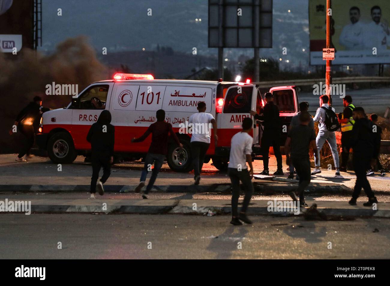Huwara, Palestinian Territories. 08th Oct, 2023. Palestinians run to an ...