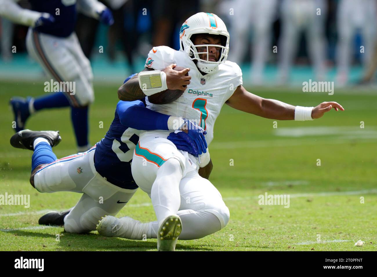 New York Giants linebacker Darren Waller (58) bring down Miami Dolphins ...