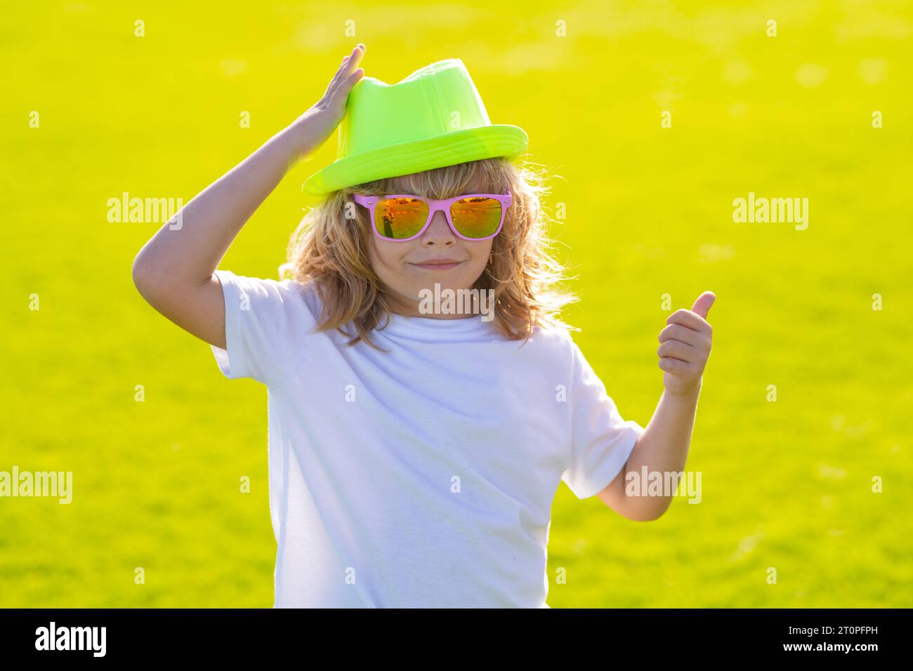 Summer kids in hat and sunglasses. Portrait of kid boy in nature, park ...