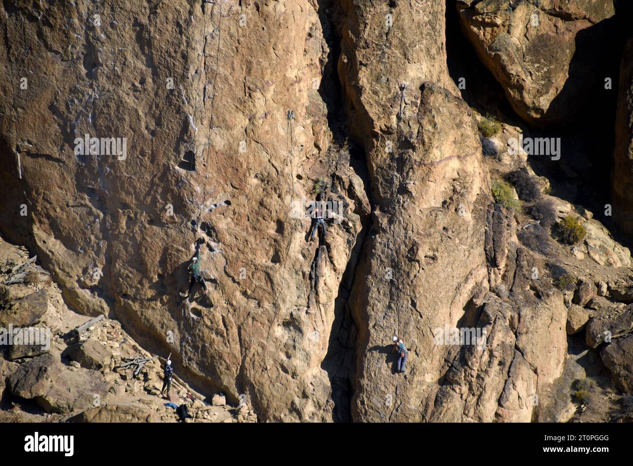 Smith Rock State Park attracts many mountain climbers. Here three are ...