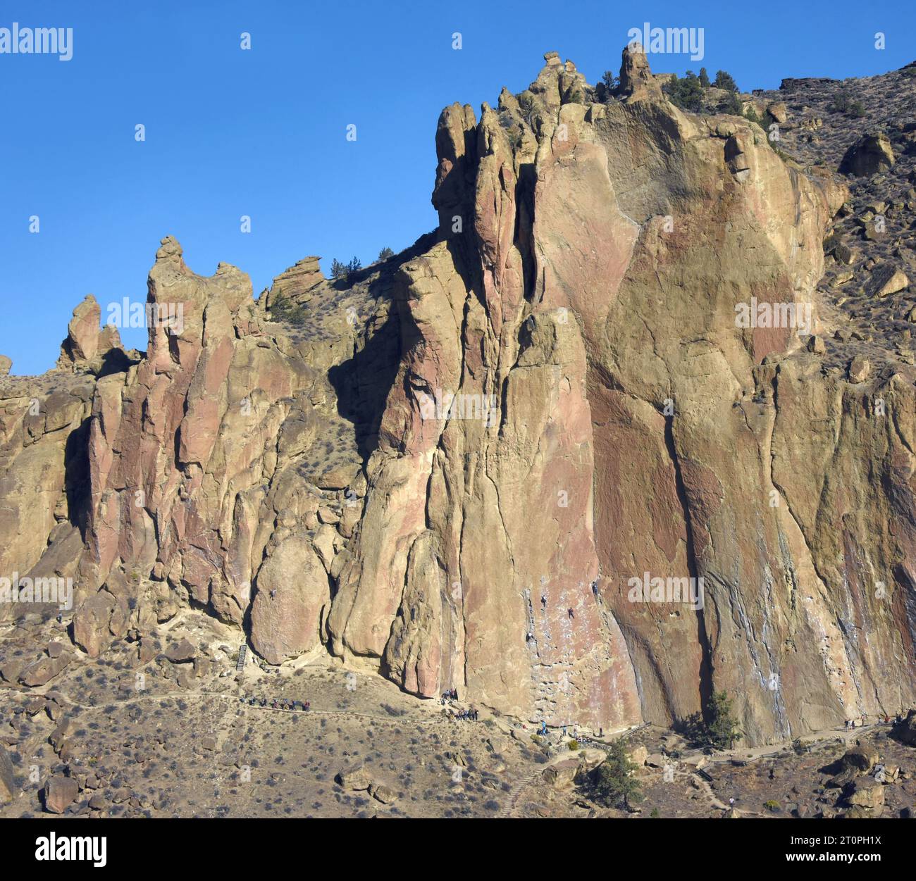 Size perspective is shown in photo of mountain with climbers appearing ...