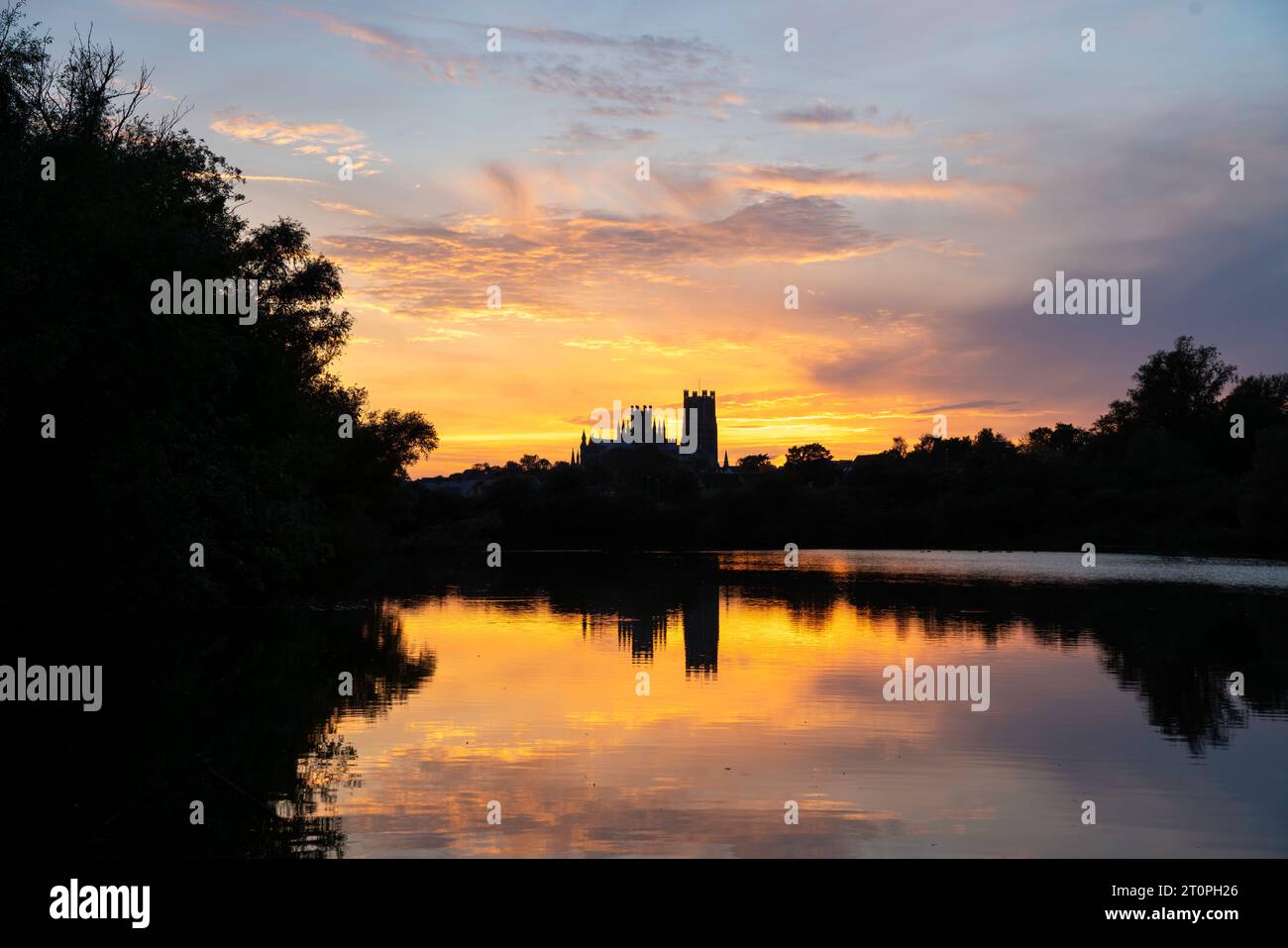 Sunset behind Ely Cathedral, from Roswell Pits Nature Reserve Stock ...