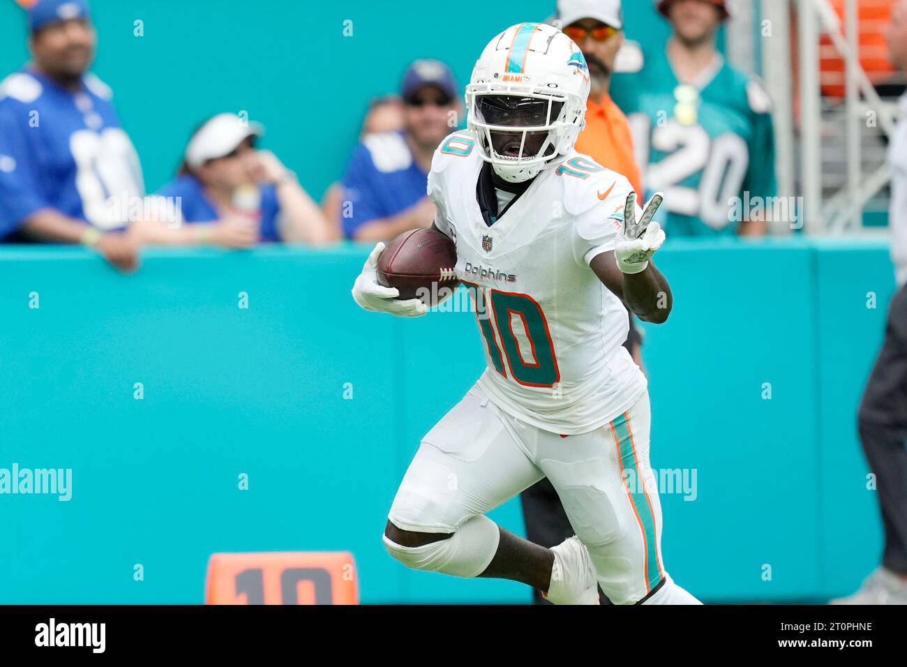 Miami Dolphins wide receiver Tyreek Hill (10) gestures as he runs for a ...