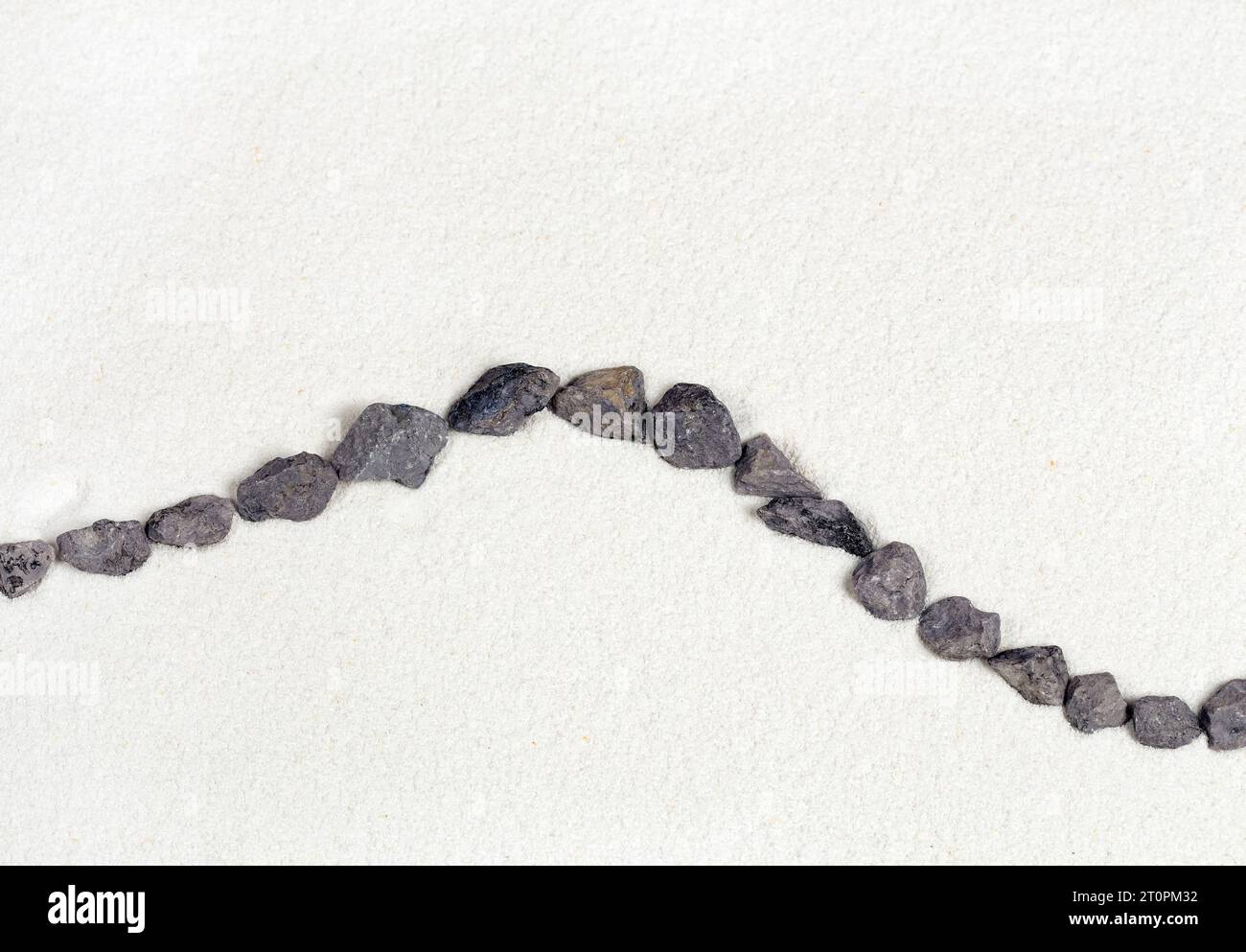 White sand with the stone line Stock Photo - Alamy