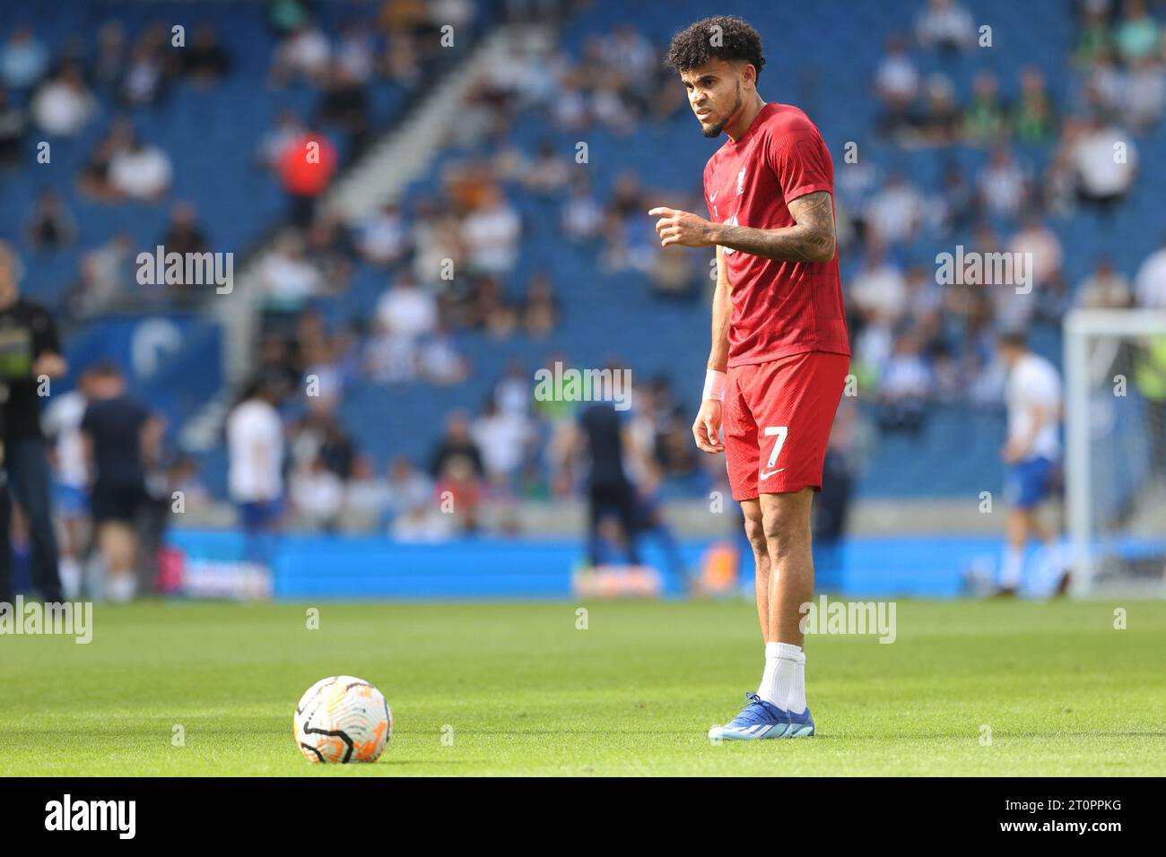 Luis Diaz warms up before kick off for Liverpool FC at the AMEX Stadium ...