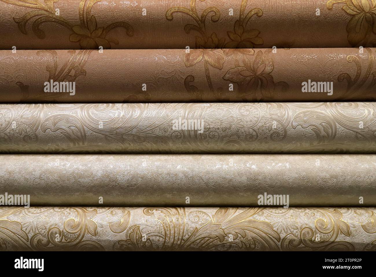 Wallpaper with geometric and floral patterns. Rolls of vinyl wallpaper ...