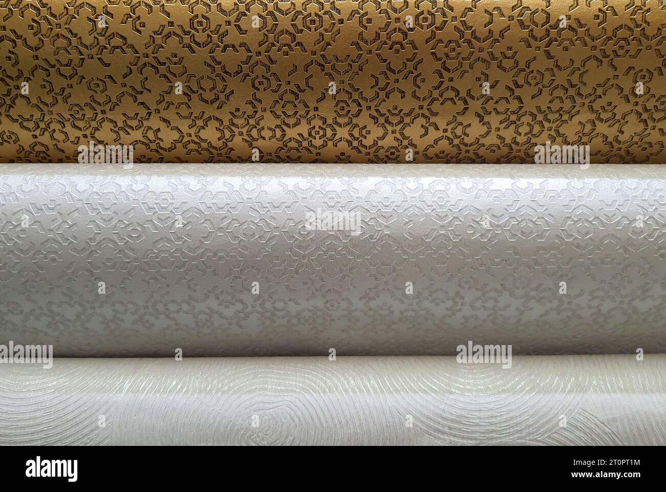 Wallpaper with geometric and floral patterns . Rolls of vinyl wallpaper ...