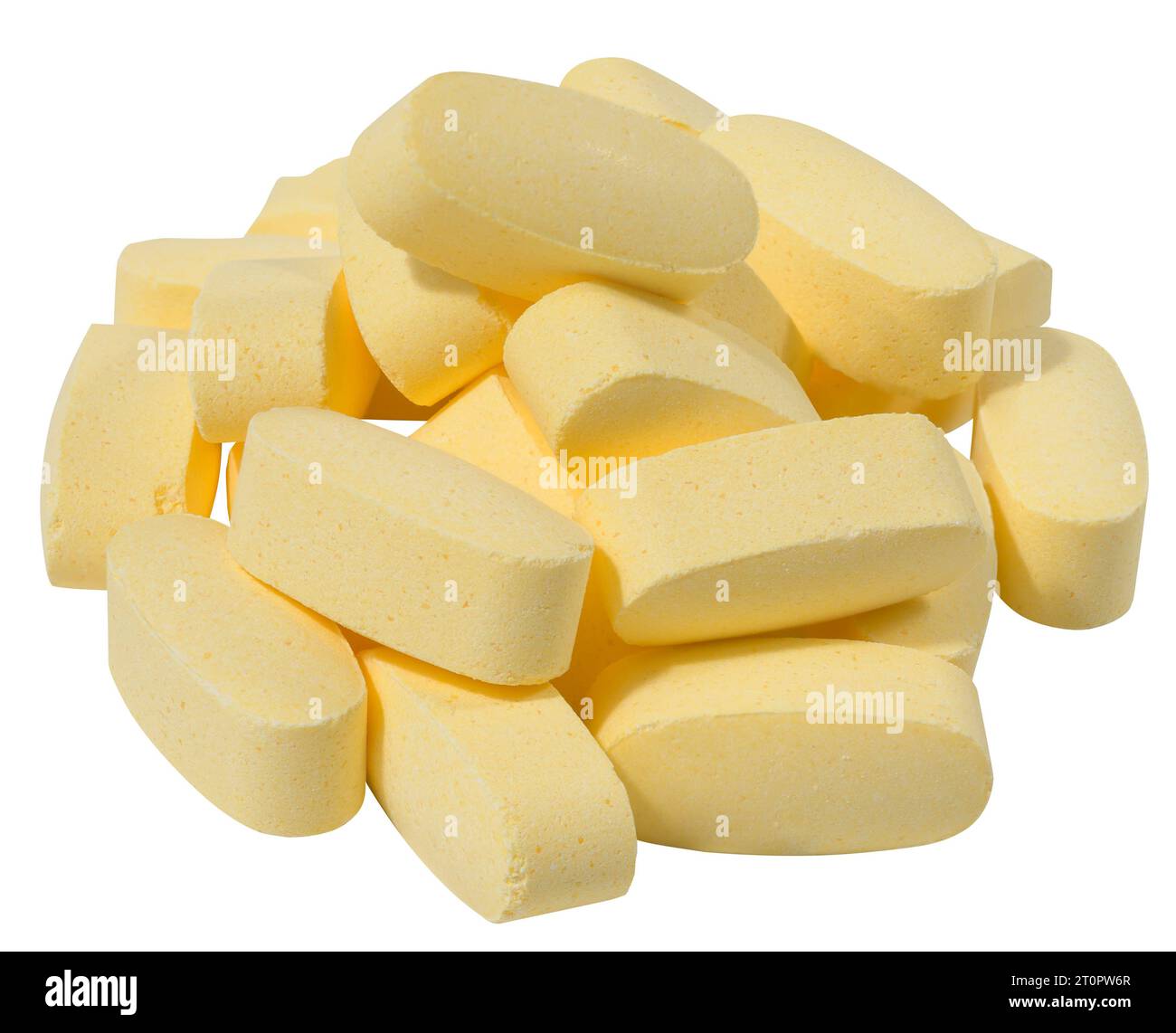 Yellow oval tablets on a white background, top view Stock Photo - Alamy