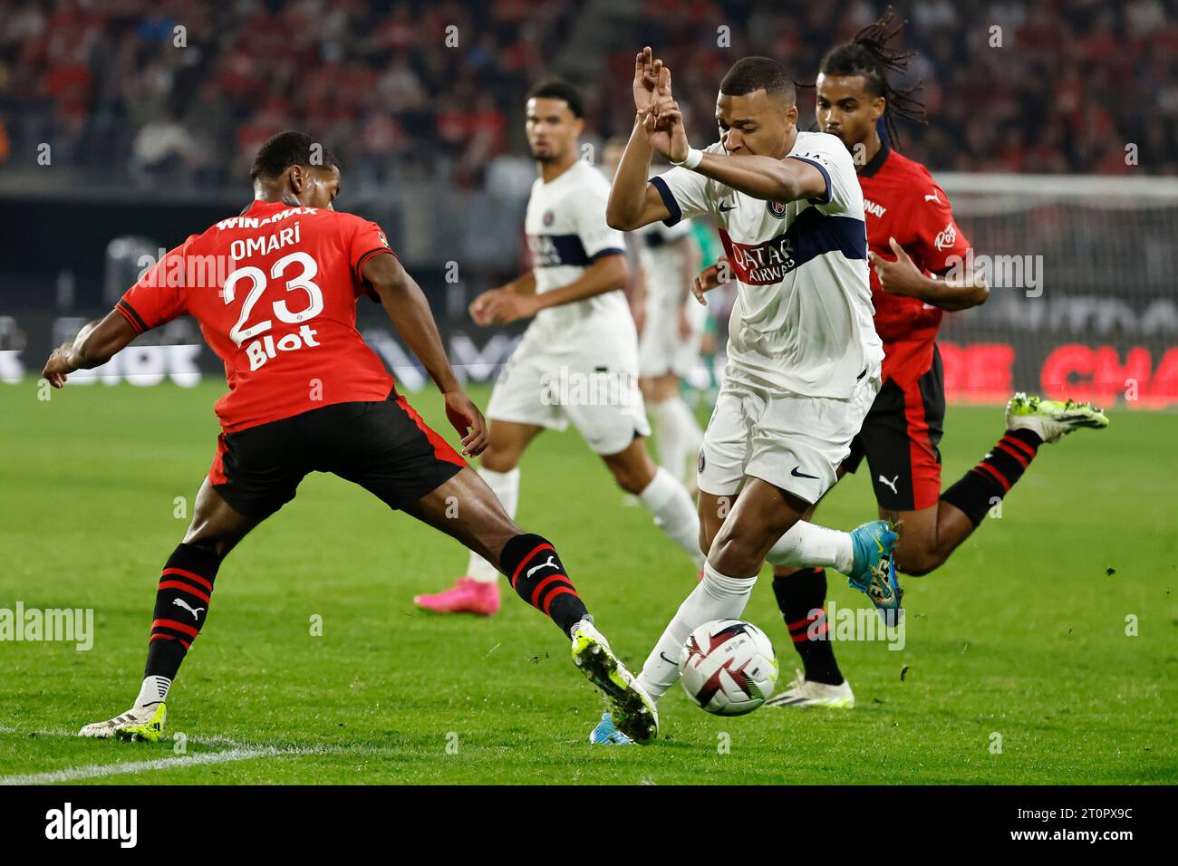 Rennes' Warmed Omari, left, in action against PSG's Kylian Mbappe ...