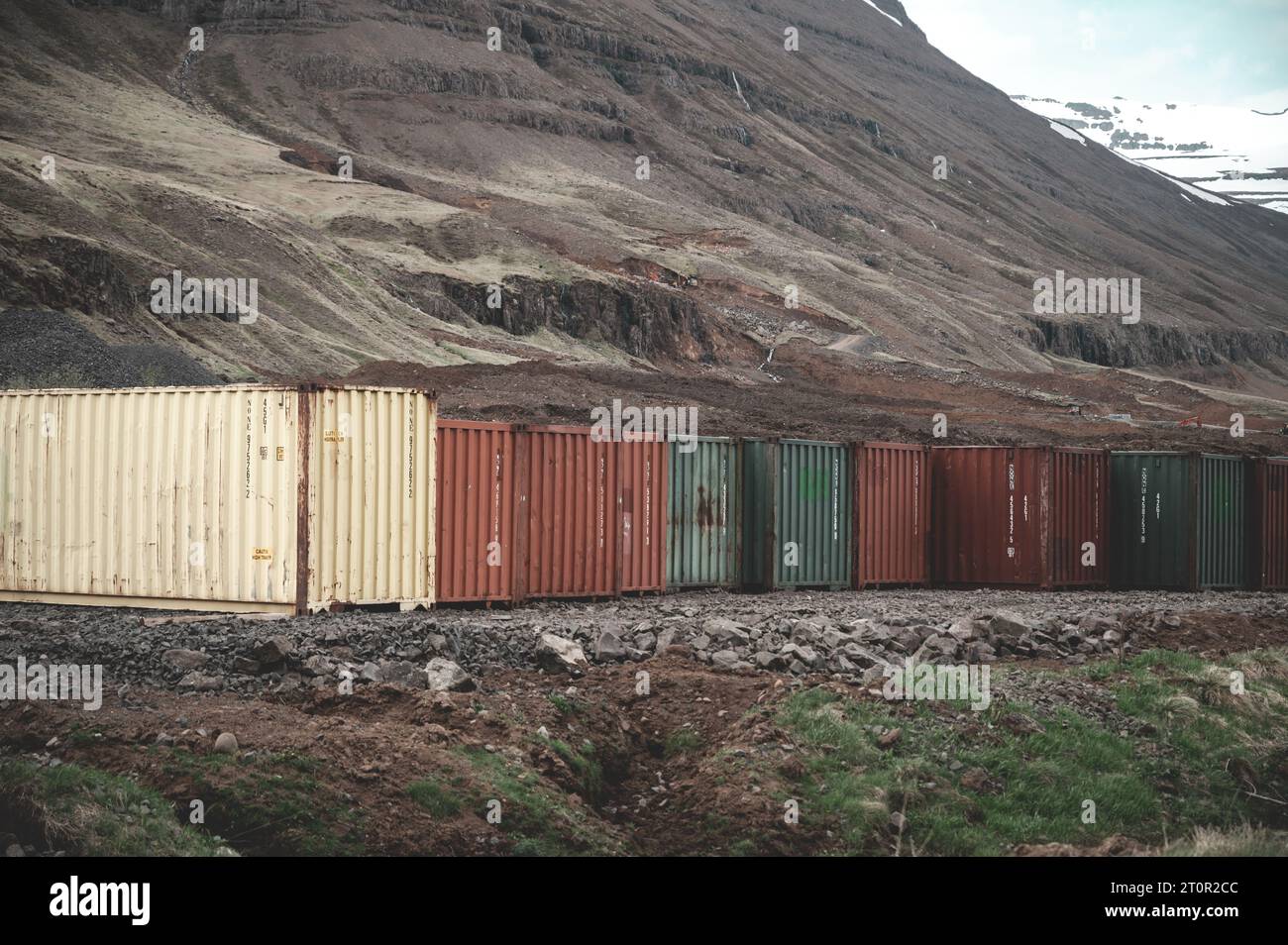 Colorful export import cargo shipping container standing next to each ...