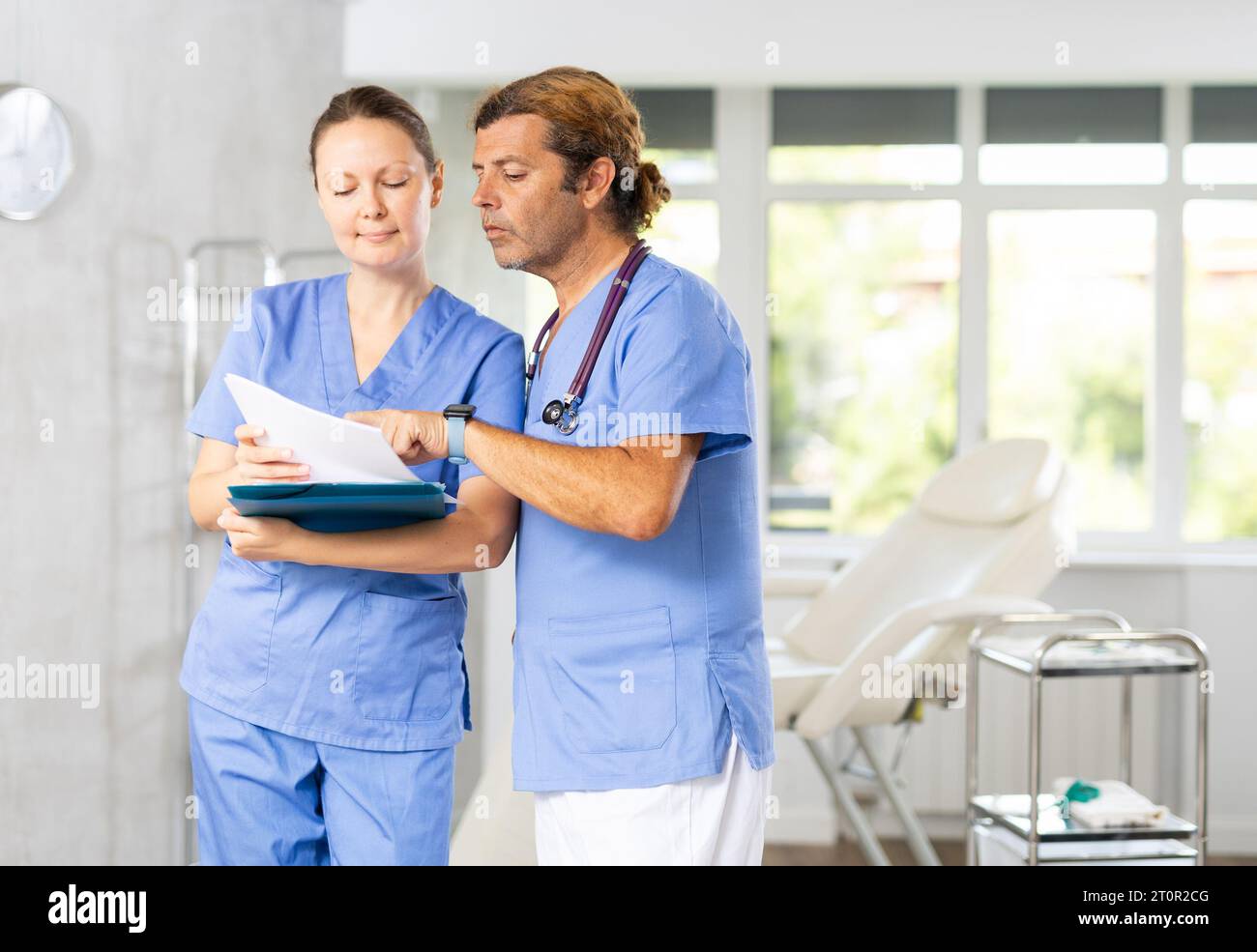 Female medicine doctor reading something hi-res stock photography and ...