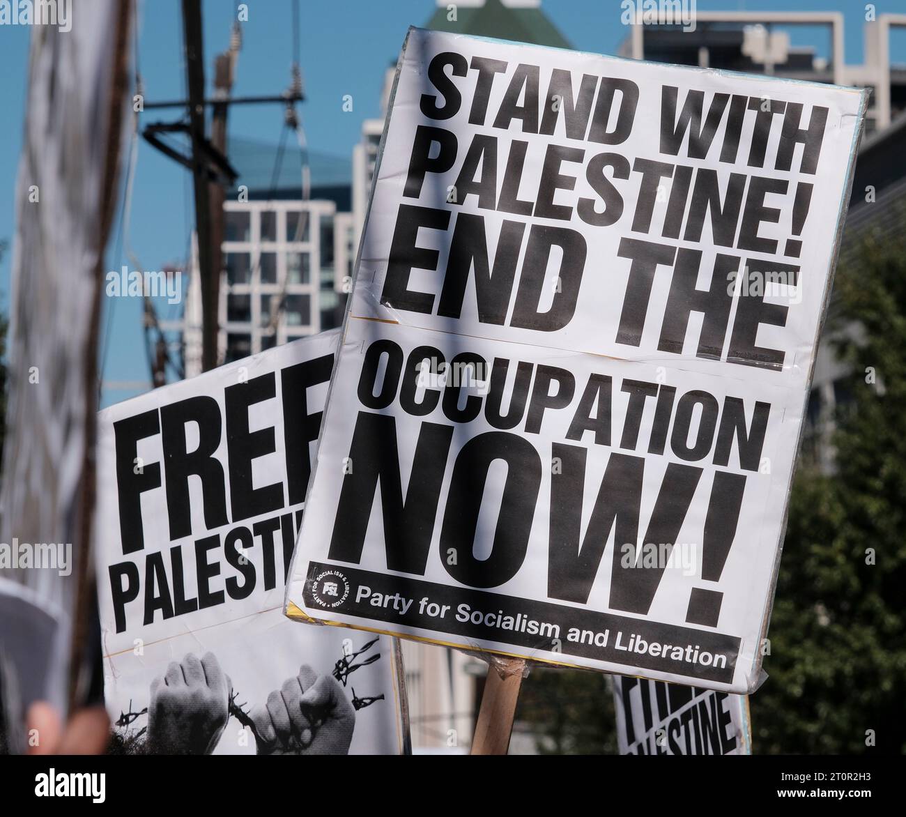 Atlanta, Georgia, USA. 8th Oct, 2023. Protesters hold signs that read ...