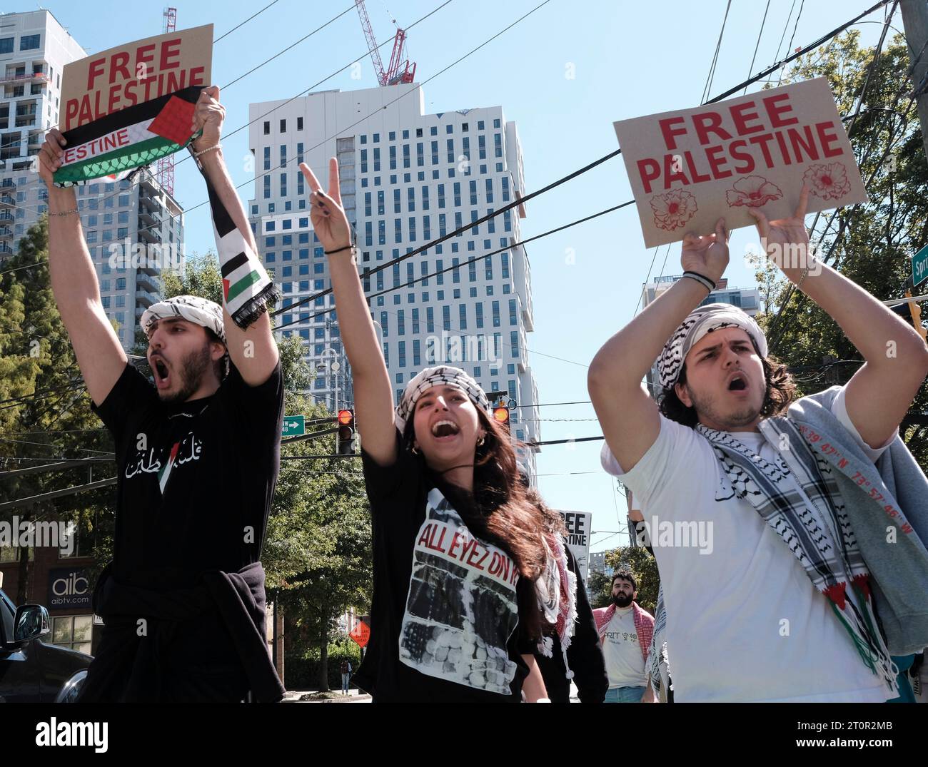 Atlanta, Georgia, USA. 8th Oct, 2023. Protesters hold signs that read ...