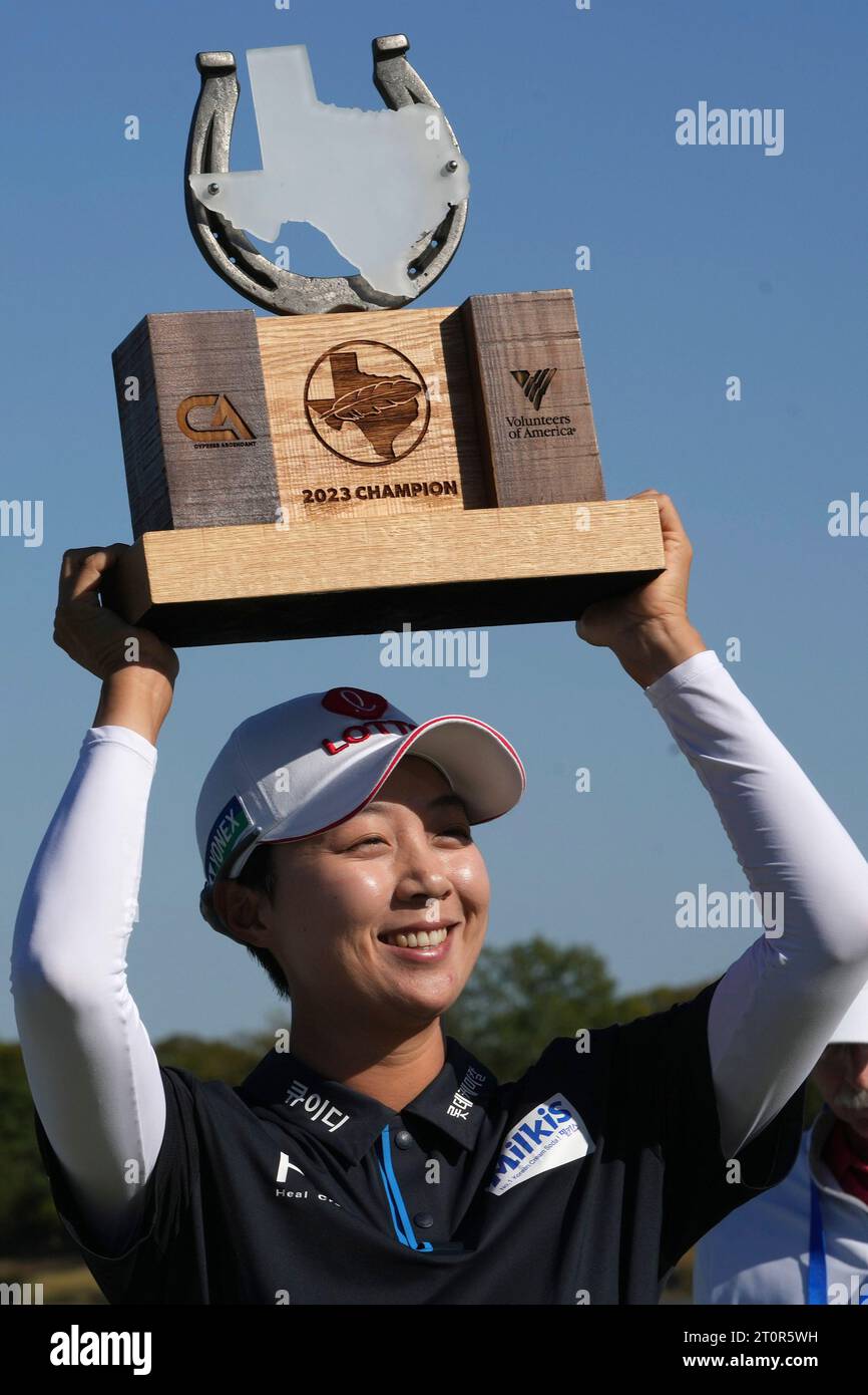 Kim Hyo-joo, of South Korea, lifts the trophy after winning the LPGA ...