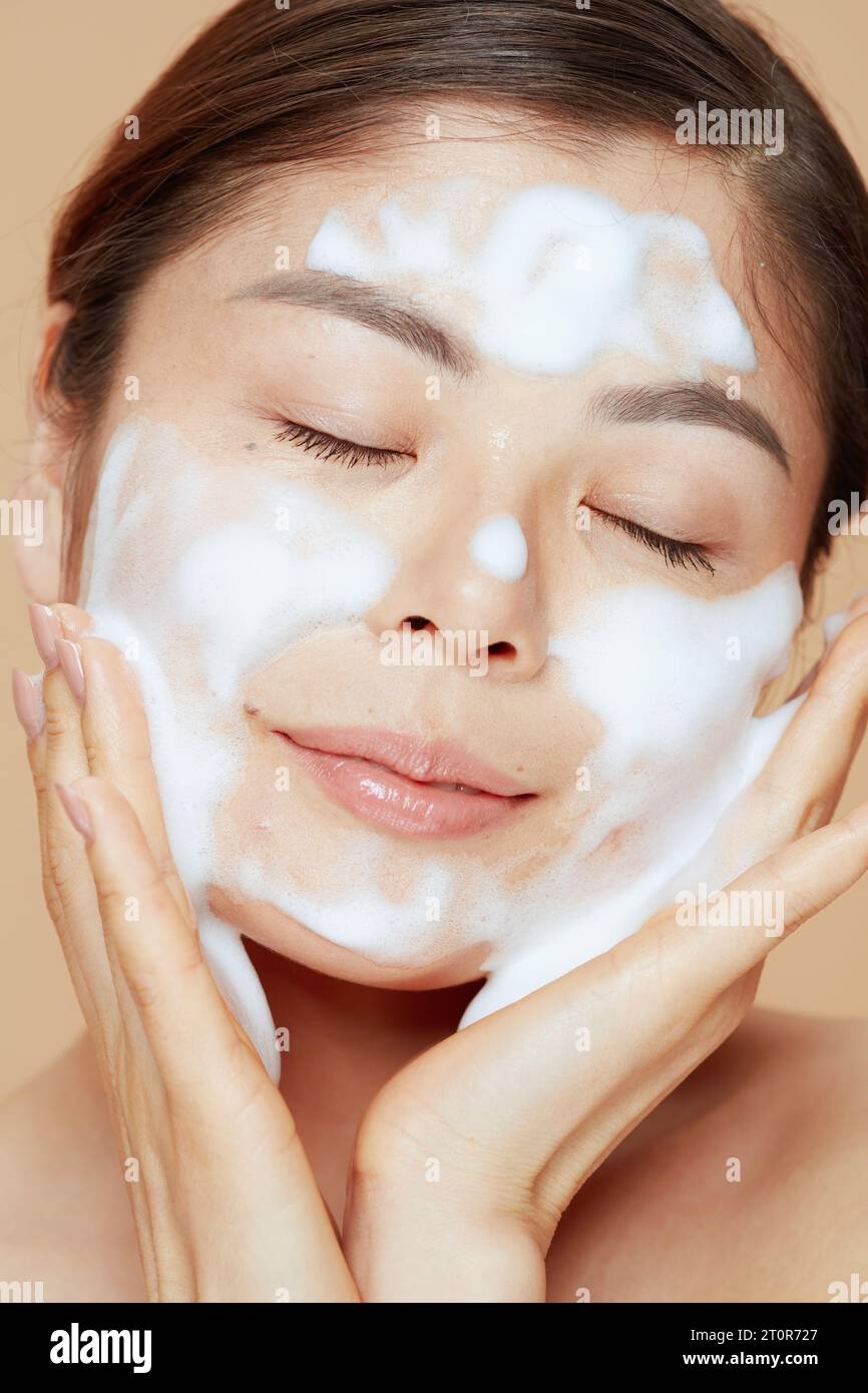 relaxed modern asian woman washing face Stock Photo - Alamy