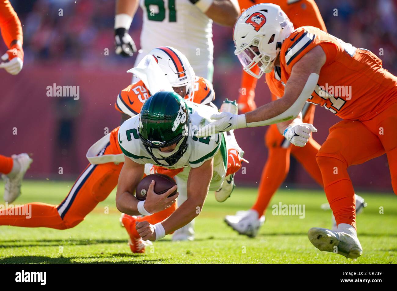 New York Jets quarterback Zach Wilson is tackled by Denver Broncos ...