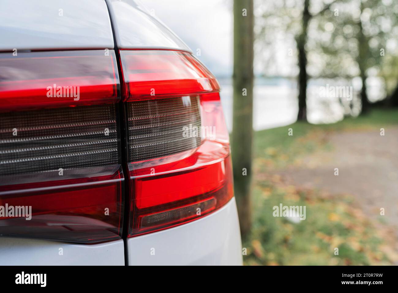 Modern white car xenon lamp headlight, back view close up. Modern car ...