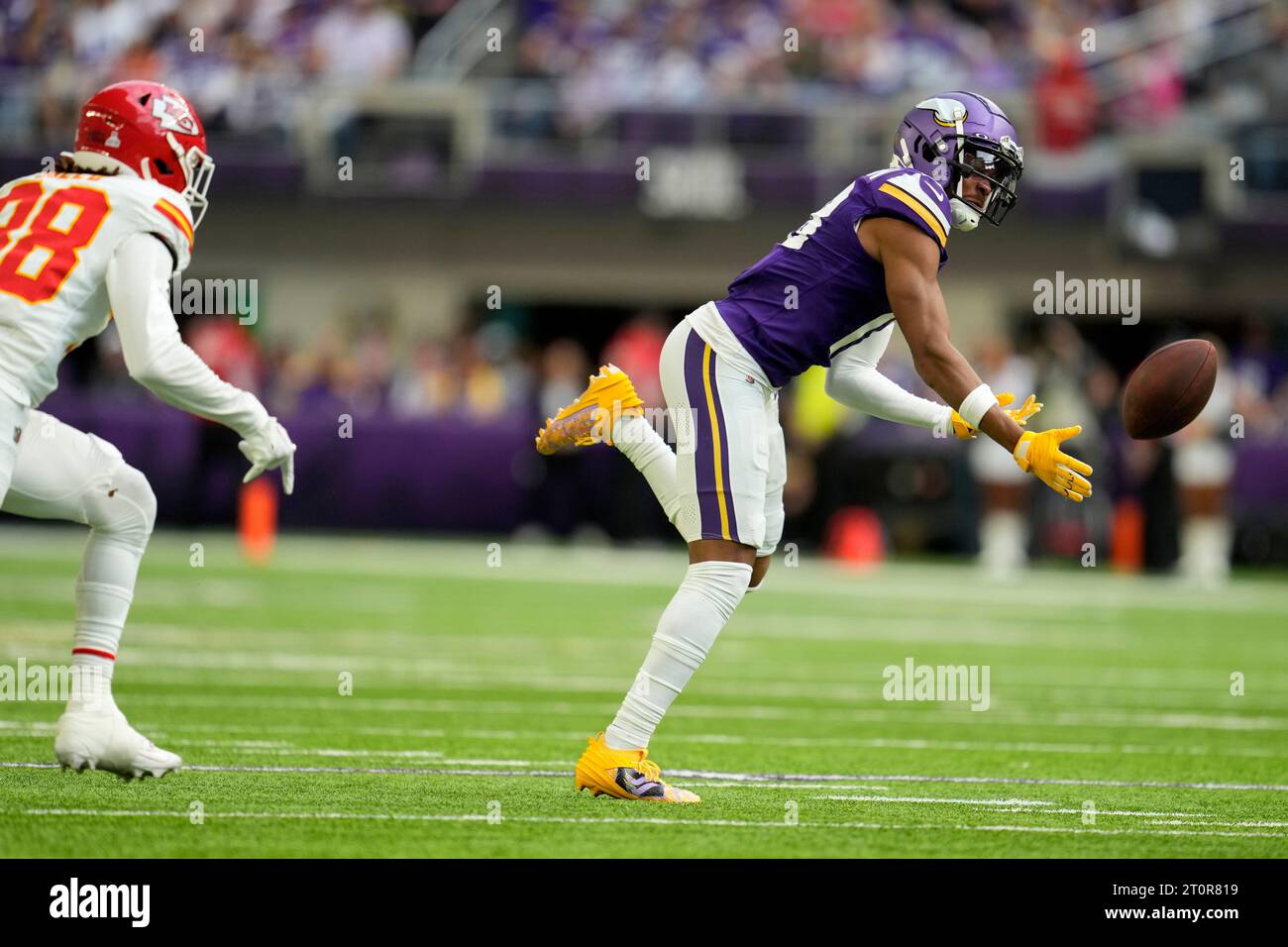 Minnesota Vikings wide receiver Justin Jefferson looks to catch a pass in front of Kansas City ...