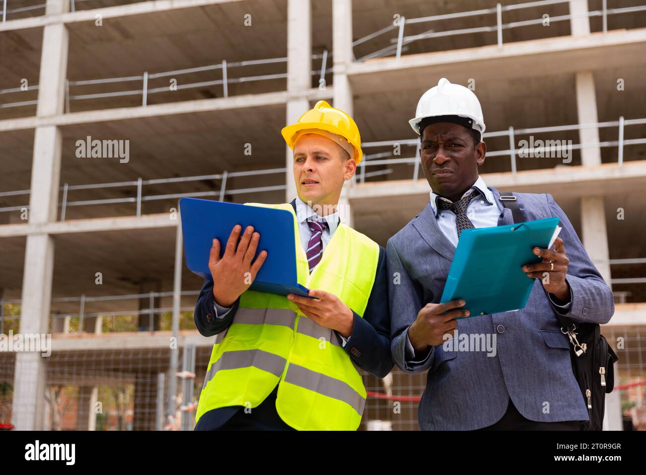 Architect and engineer talking about project of new building Stock ...