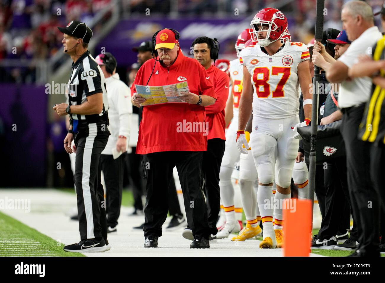 Kansas City Chiefs head coach Andy Reid and tight end Travis Kelce (87) watch from the sideline ...