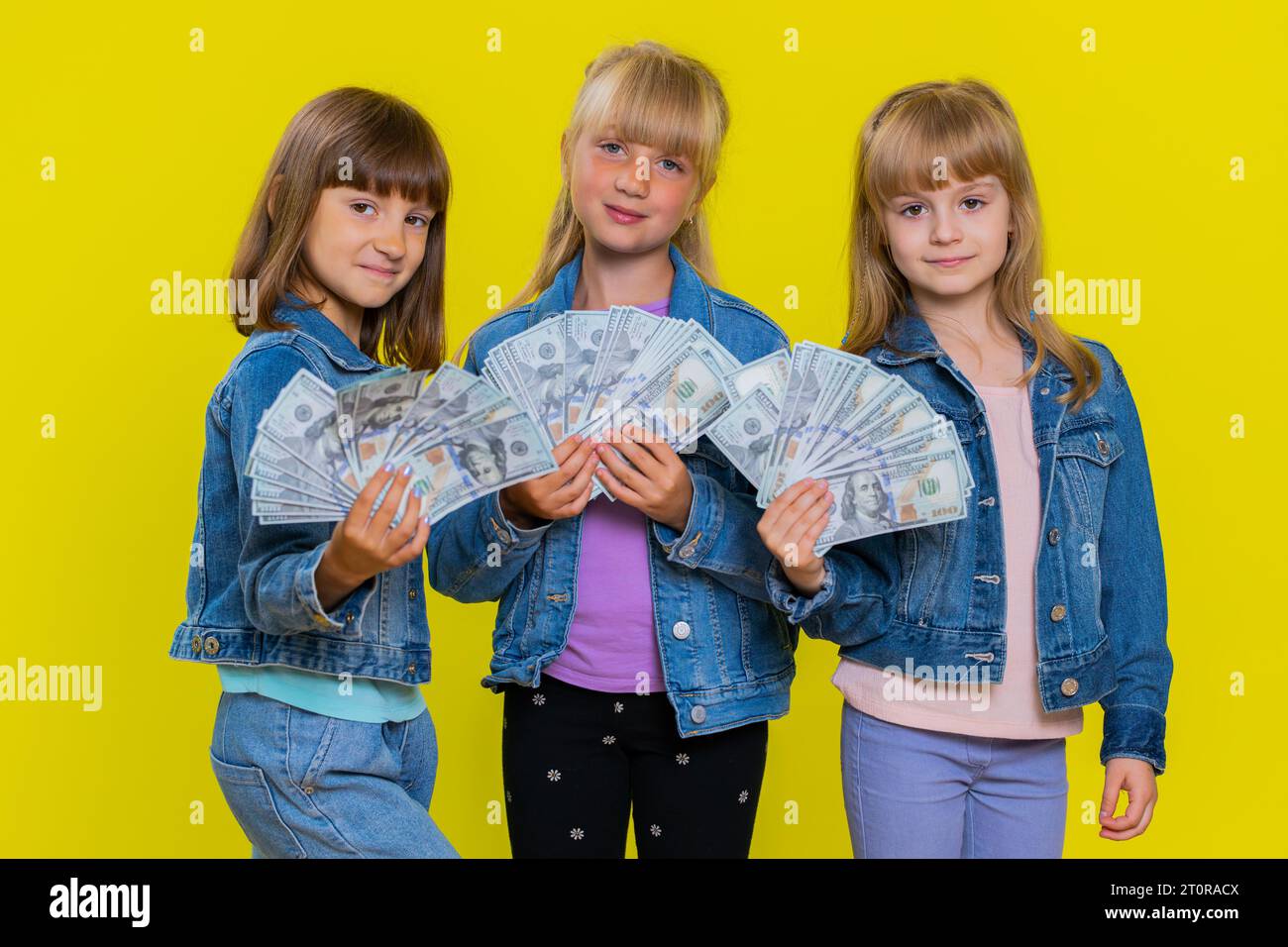 Rich happy teenage girls waving money dollar cash banknotes bills like ...