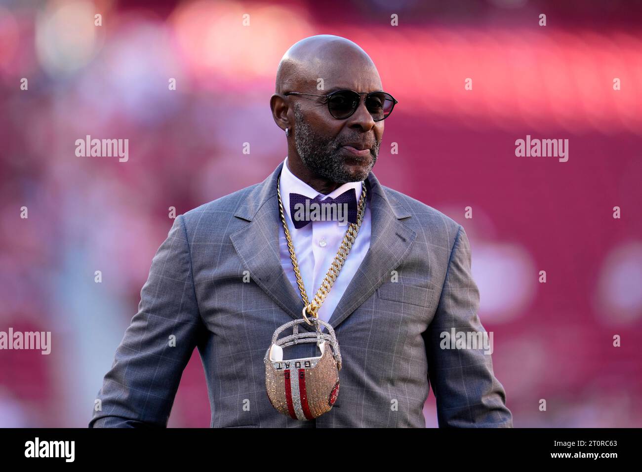 Former wide receiver Jerry Rice stands on the field before an NFL ...