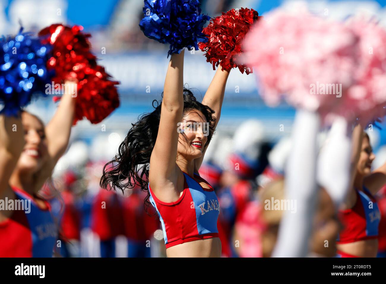 Kansas cheerleaders perform before an NCAA college football game ...