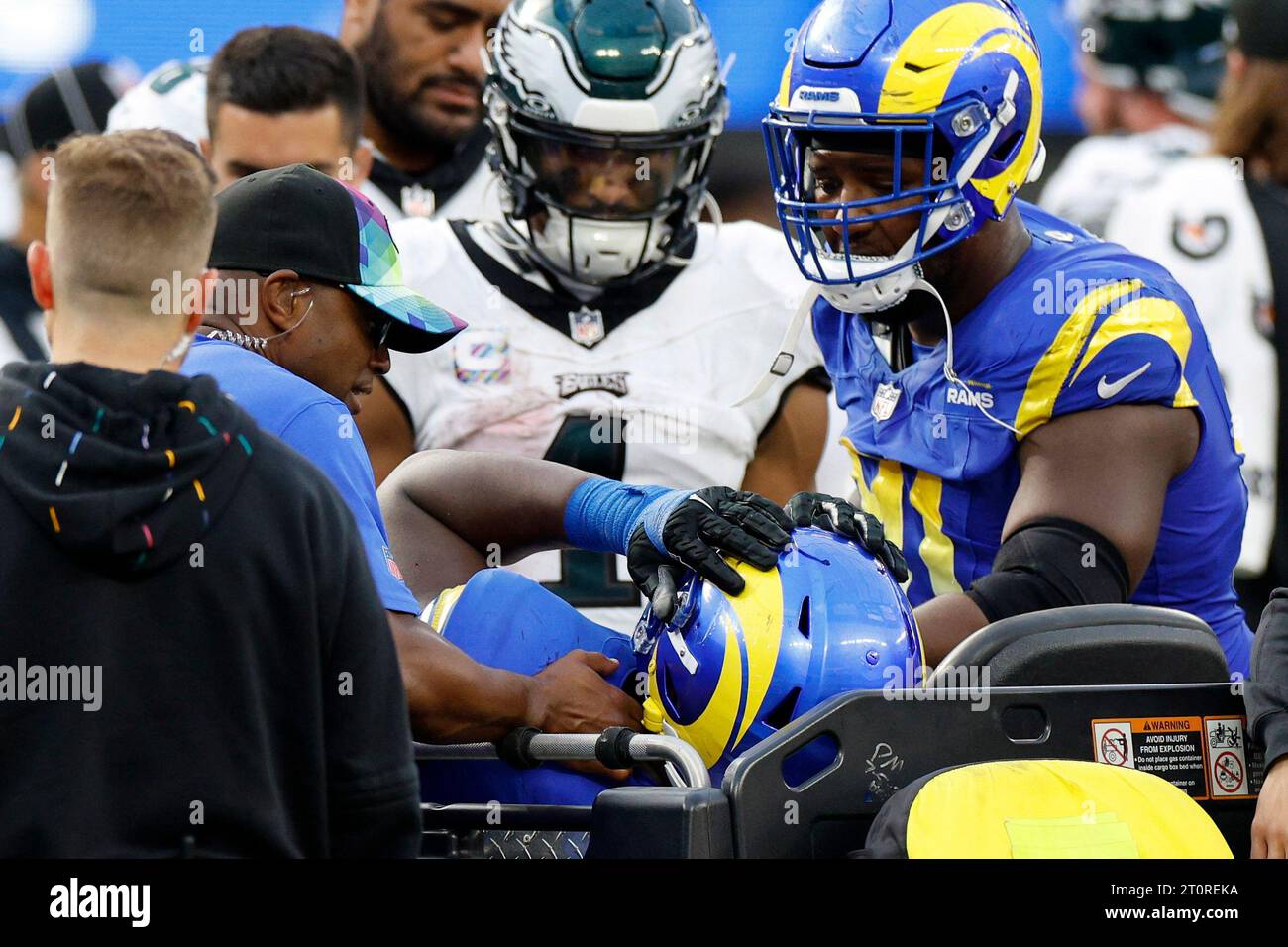 Los Angeles Rams defensive tackle Bobby Brown III, below, is checked on ...