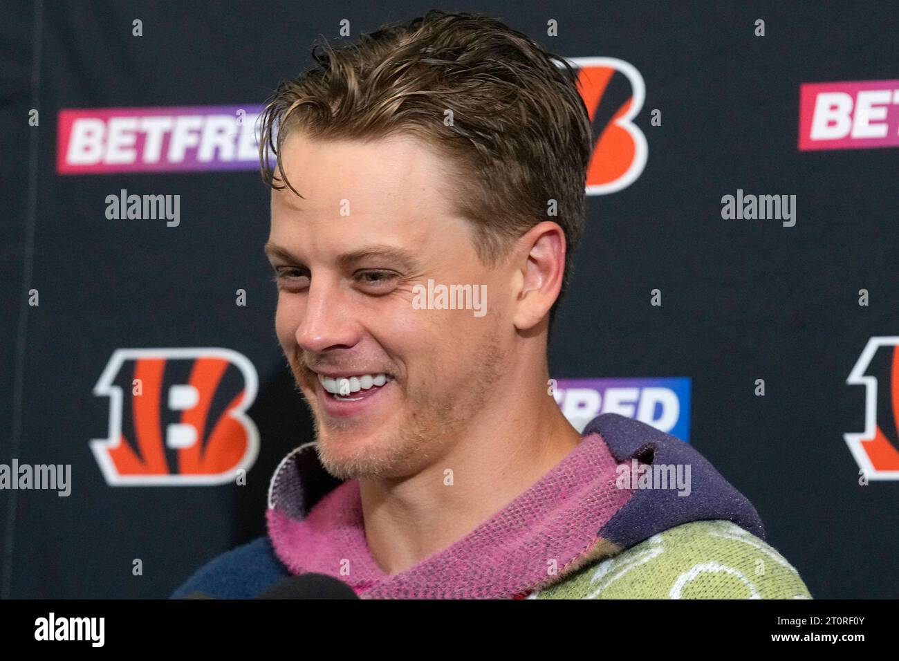 Cincinnati Bengals quarterback Joe Burrow smiles as he is asked a ...