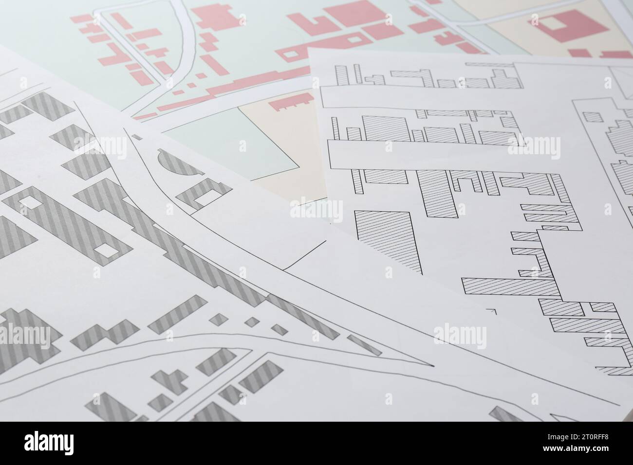 Many different cadastral maps of territory with buildings as background ...
