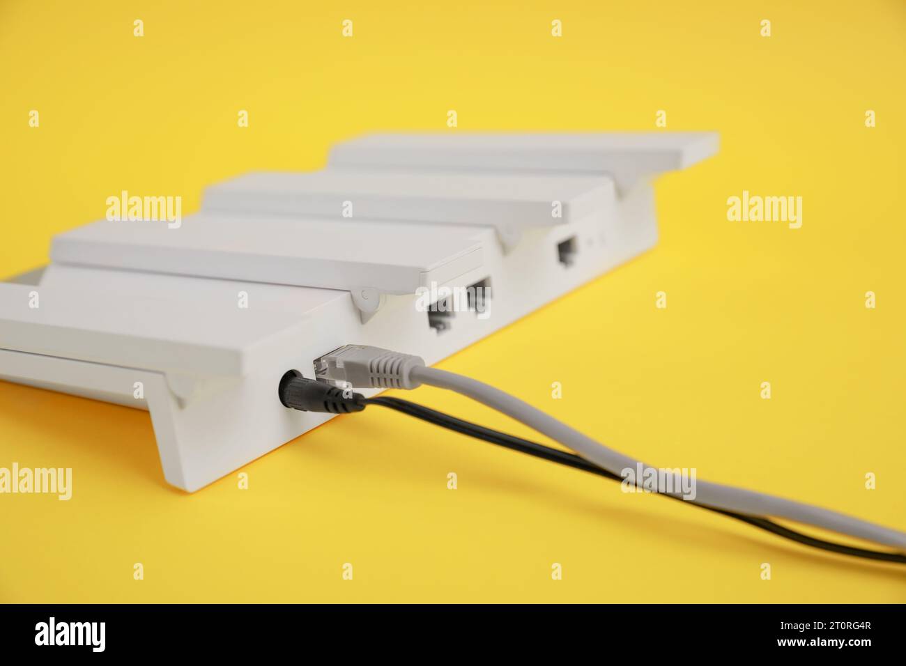 Modern Wi-Fi router on yellow background, closeup Stock Photo - Alamy