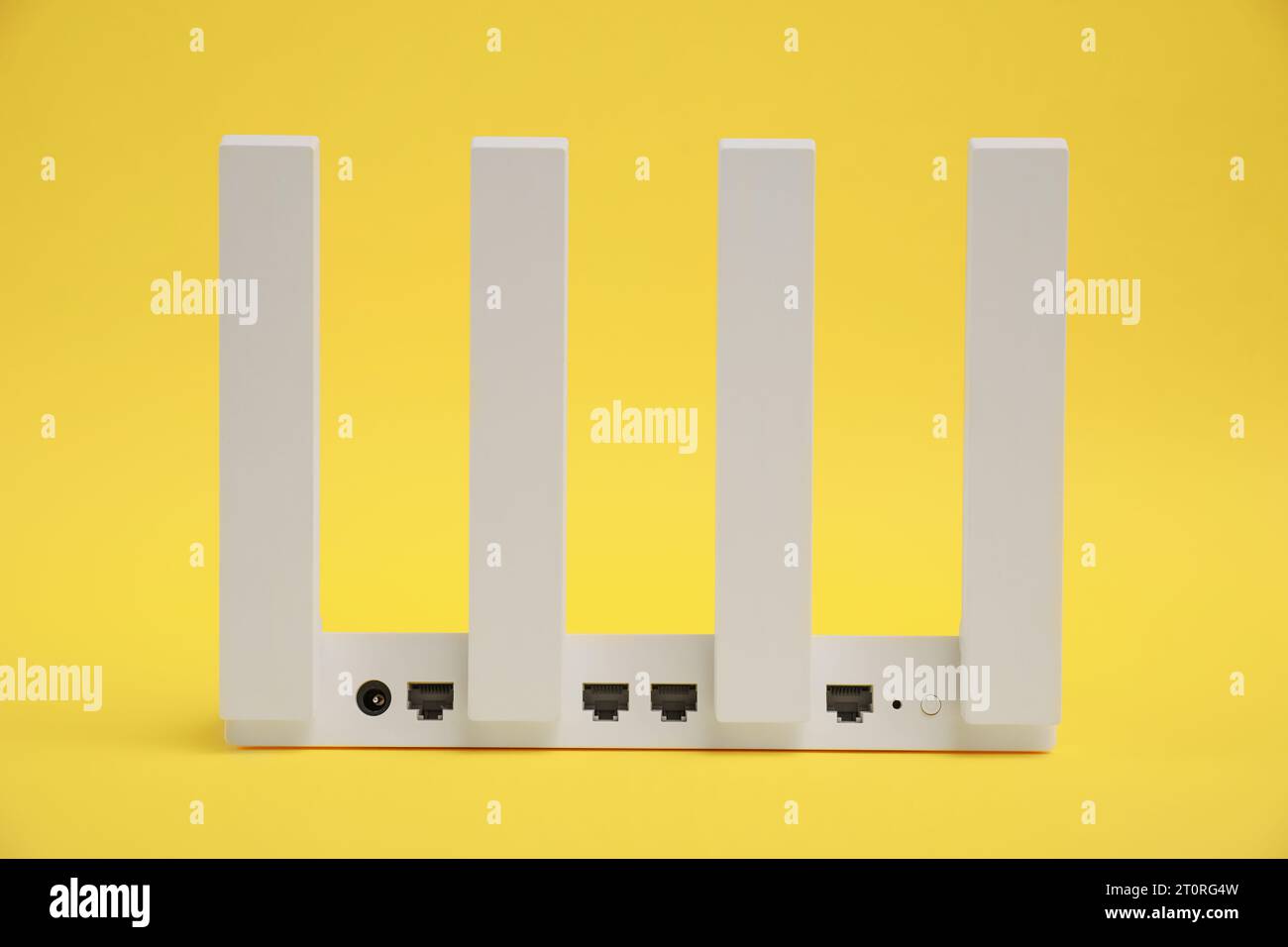 One modern Wi-Fi router on yellow background Stock Photo - Alamy