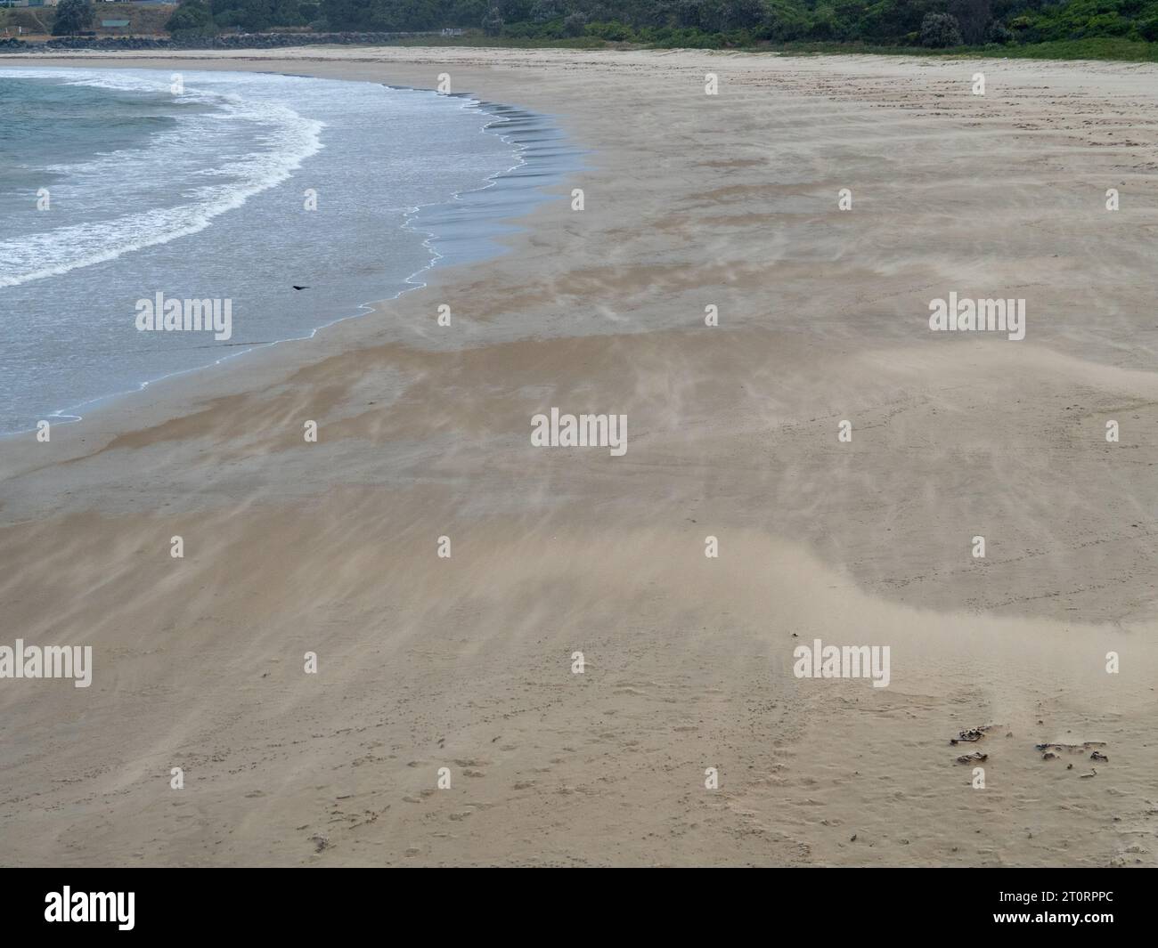 Strong wind blowing the sand and sea on an Australian beach Stock Photo ...