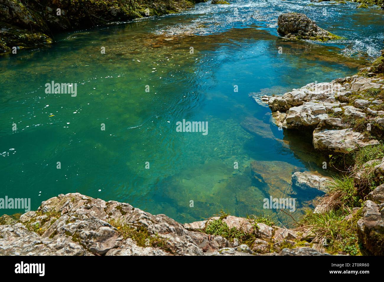The natural pool of the mountain river with emerald clear water Stock ...
