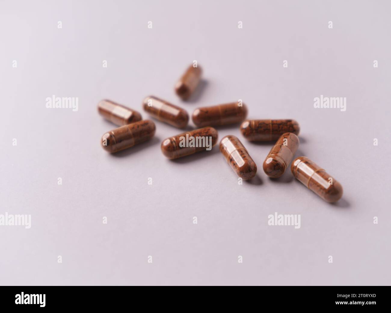 Ashwagandha (Withania somnifera) capsules. Paper background. Soft focus ...