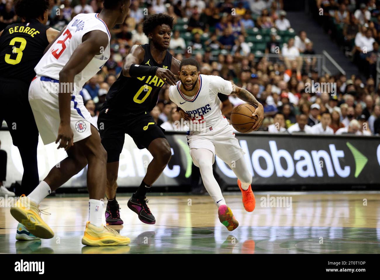 Los Angeles Clippers' Xavier Moon charges past Utah Jazz's Taylor ...