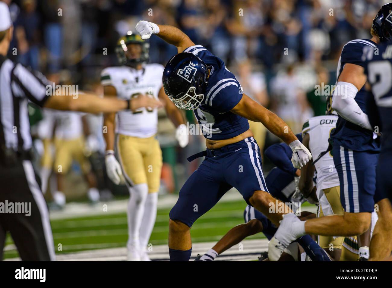 Utah State defensive end John Ward (42) celebrates a tackle for loss ...