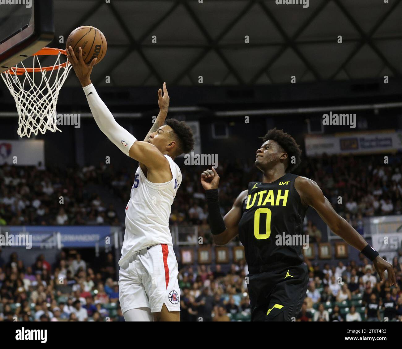 LA Clippers' Joshua Primo (11) goes to the net over Utah Jazz's Taylor ...
