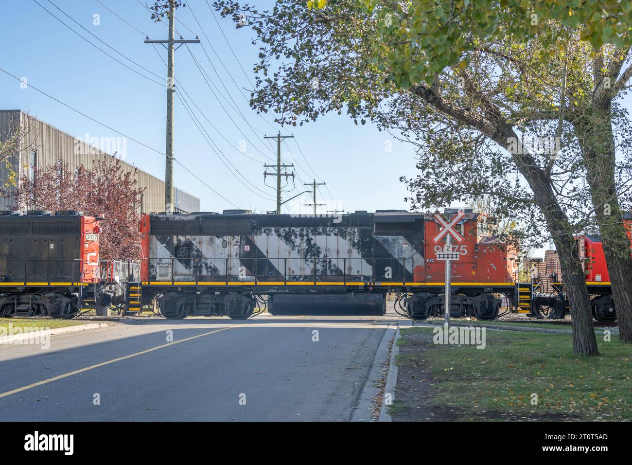 1 October 2023 - Calgary Alberta Canada - CR Locomotive Crossing a road ...