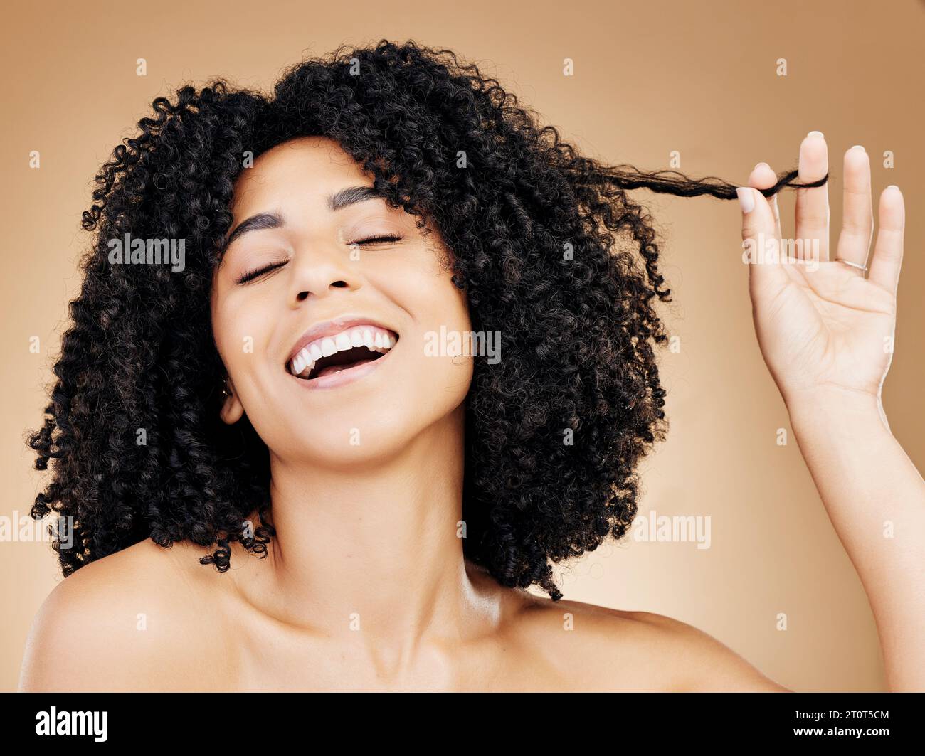 Afro, hair strand and beauty of woman in studio for natural growth, coil textures and results on ...