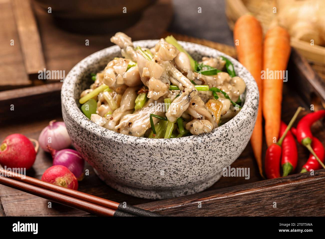 Sautéed Bullfrog with Black Pepper Sauce in stone pot Stock Photo - Alamy