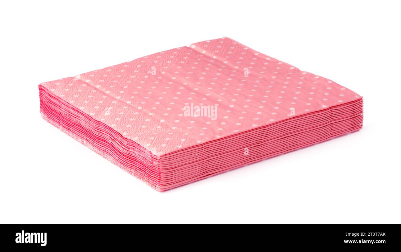 Stack of pink dotted paper napkins on white background Stock Photo - Alamy