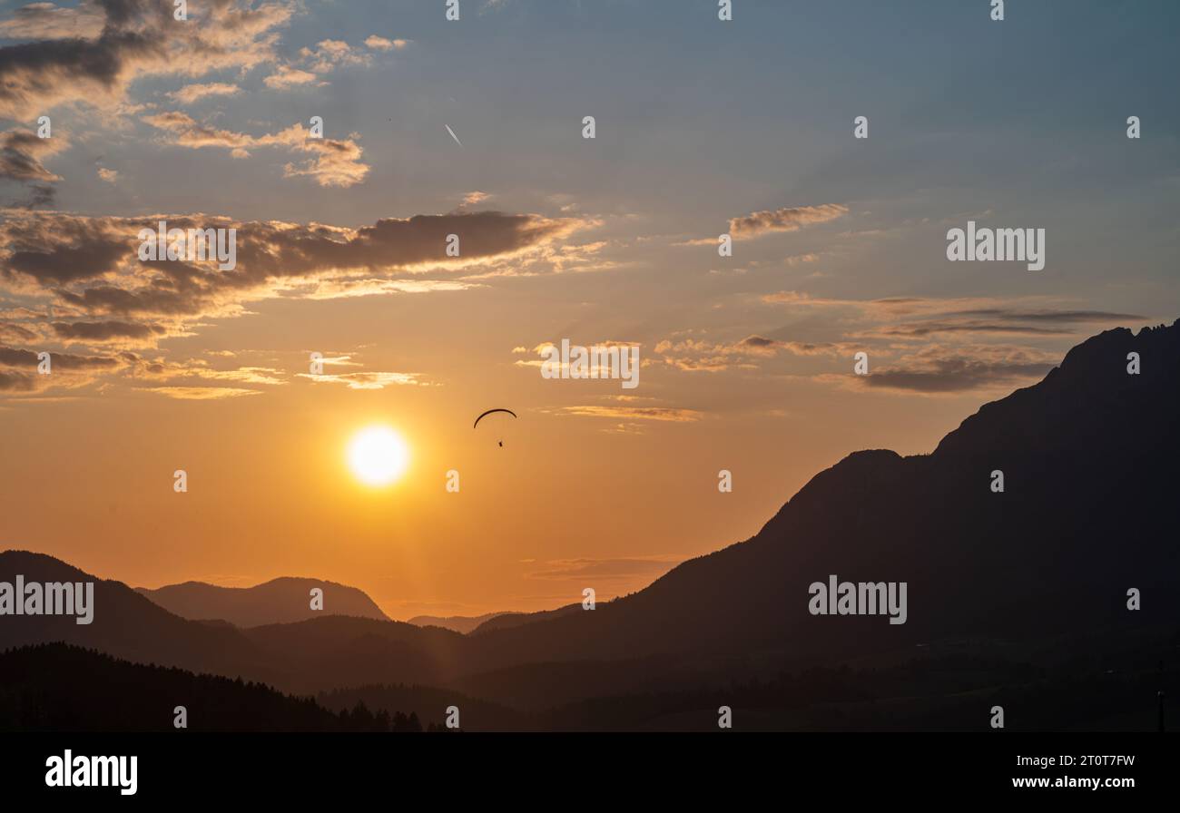 Sunset in Ellmau Austria with view on "Der Wilde Kaiser". A Person is ...